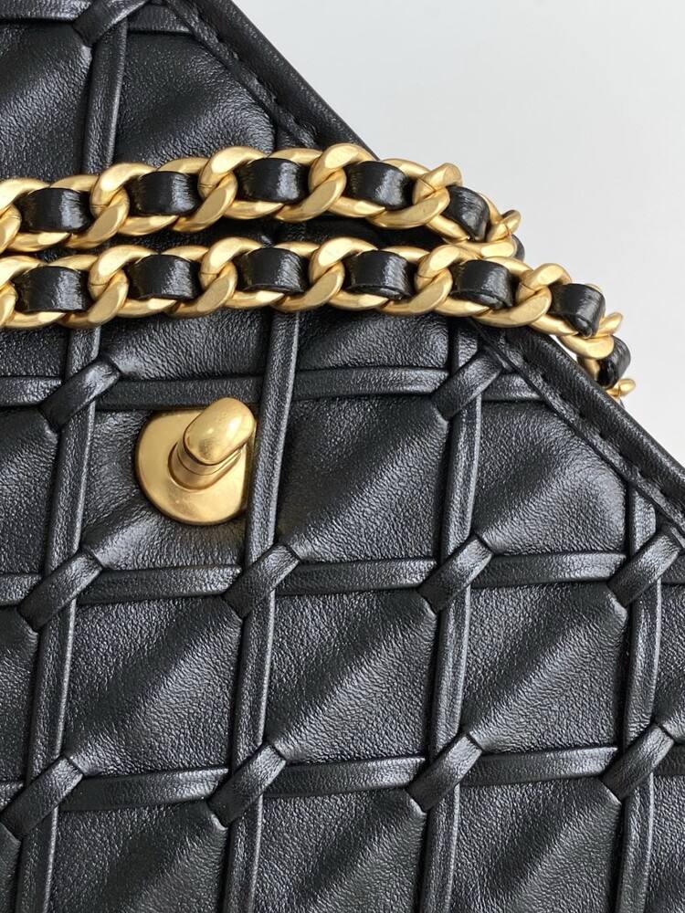 This image shows two black Chanel Classic Flap Bags side-by-side ...